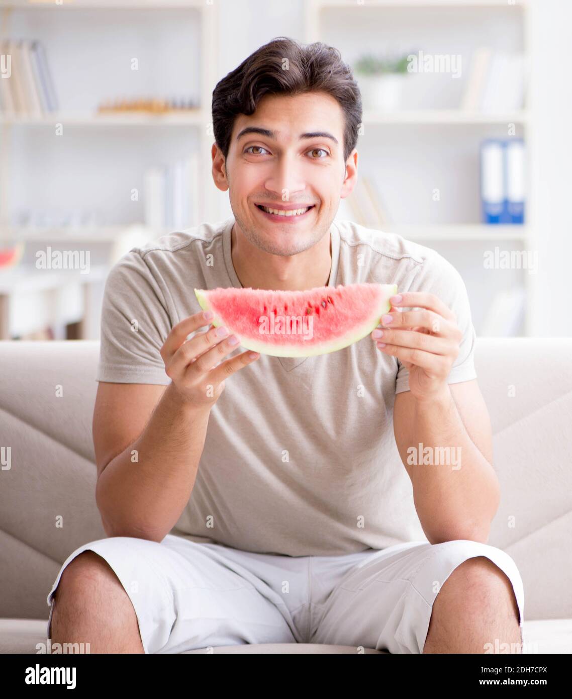 Handsome smiling boy eating tasty hi-res stock photography and images ...