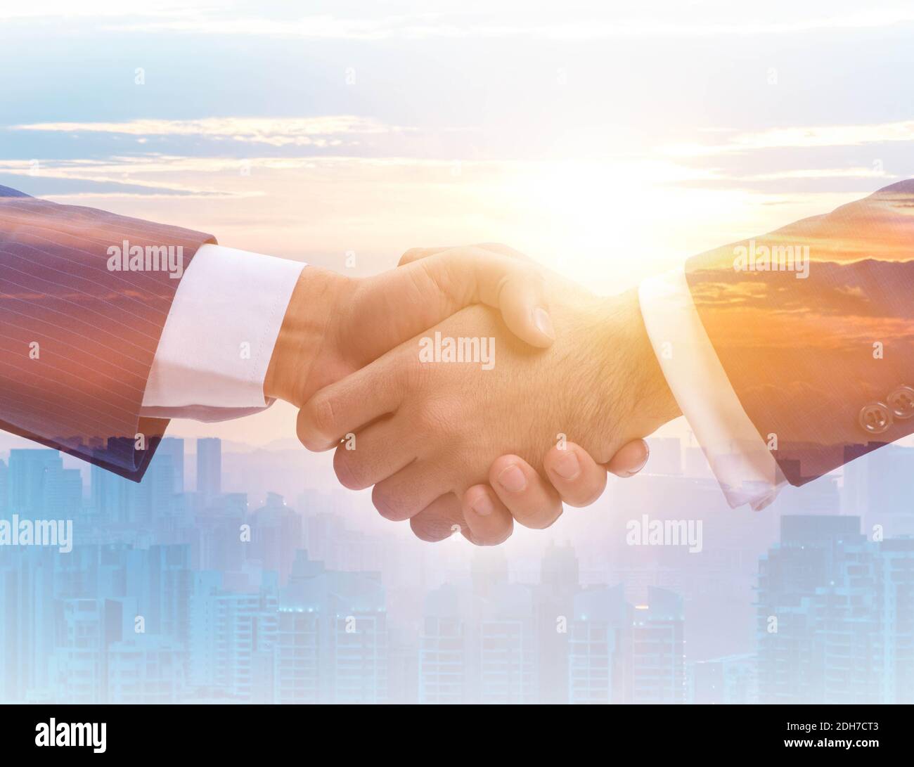 Concept of cooperation with handshake Stock Photo - Alamy