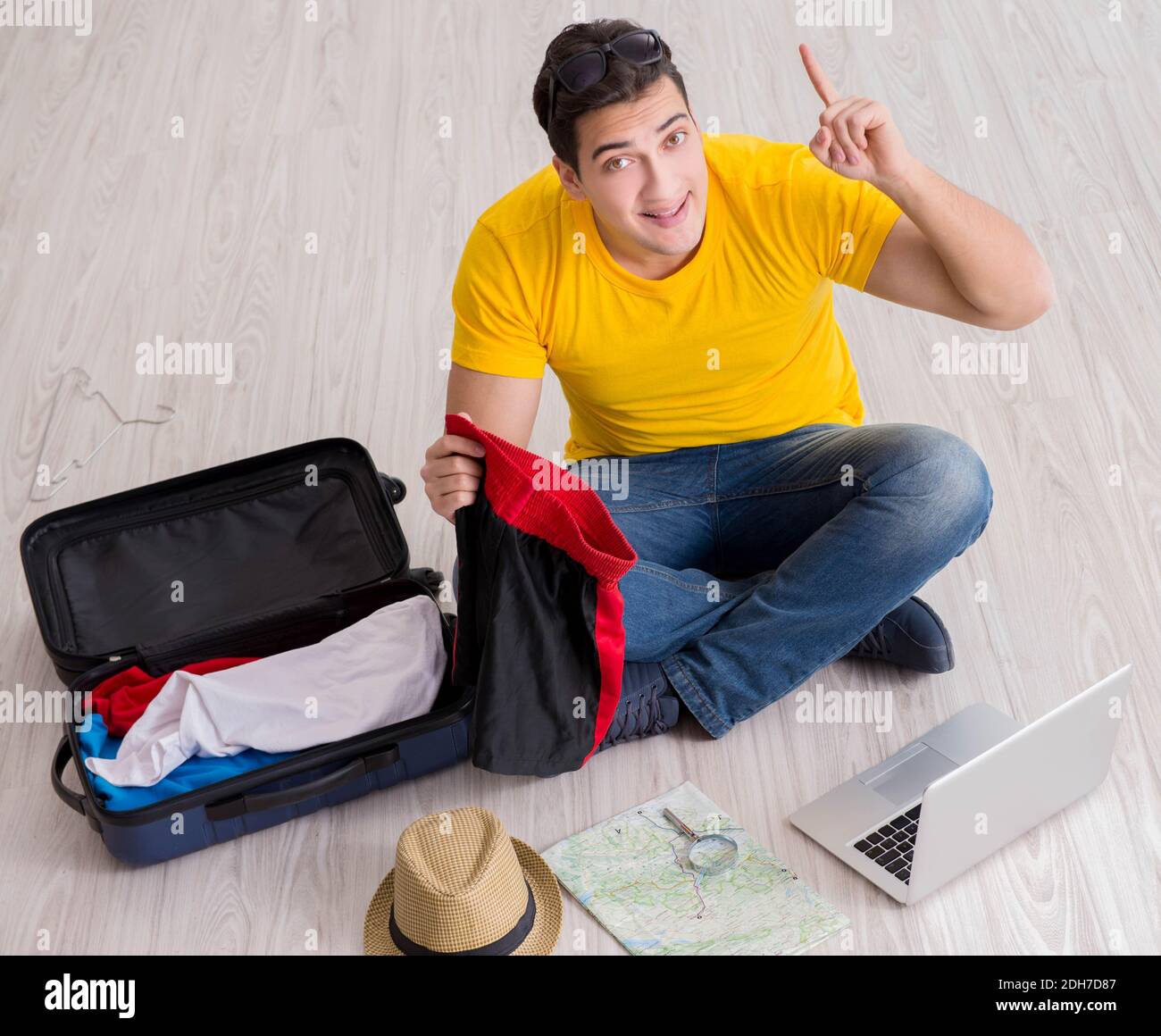 Man planning his vacation trip with map Stock Photo - Alamy