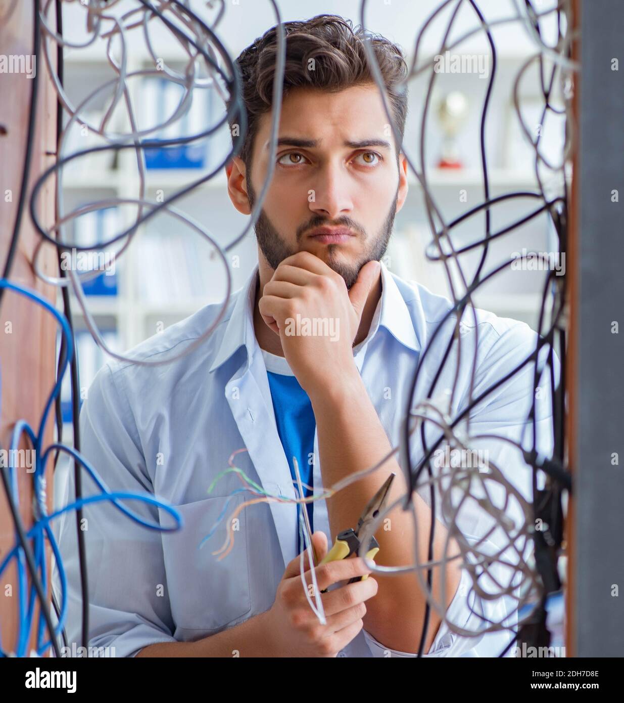 Computer repairman working on repairing network in IT workshop Stock ...