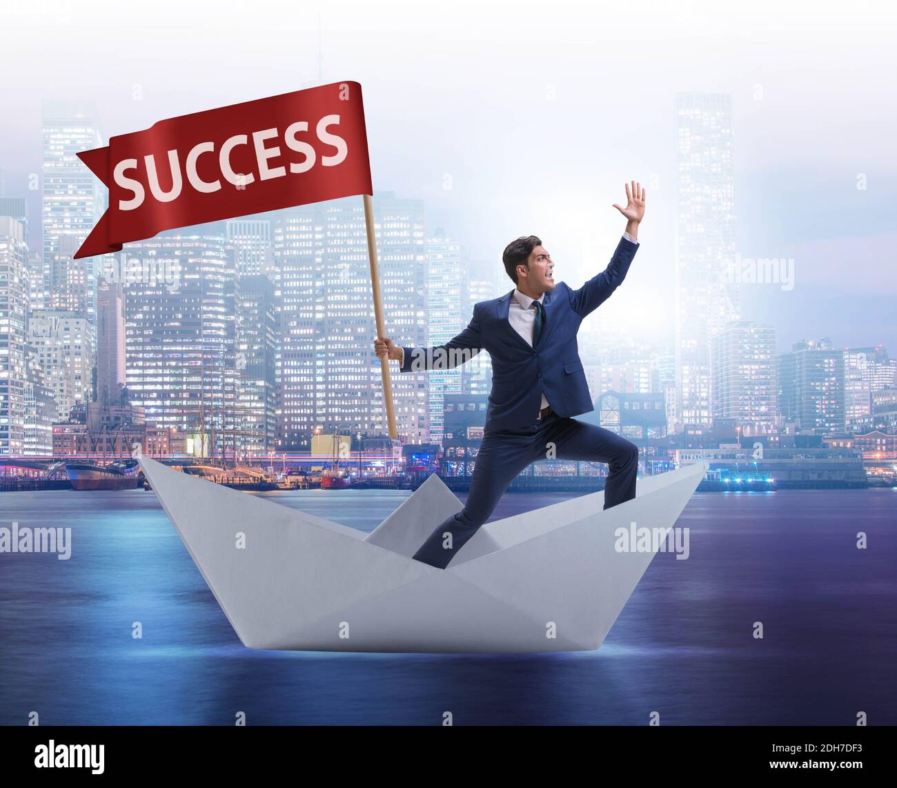 Businessman riding paper boat ship in success concept Stock Photo - Alamy