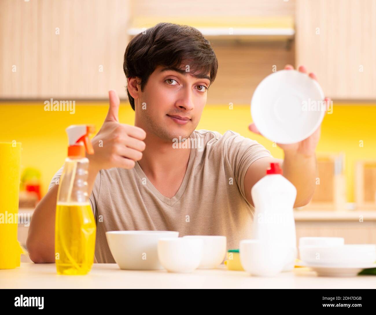 Man washing dishes plates hi-res stock photography and images - Alamy