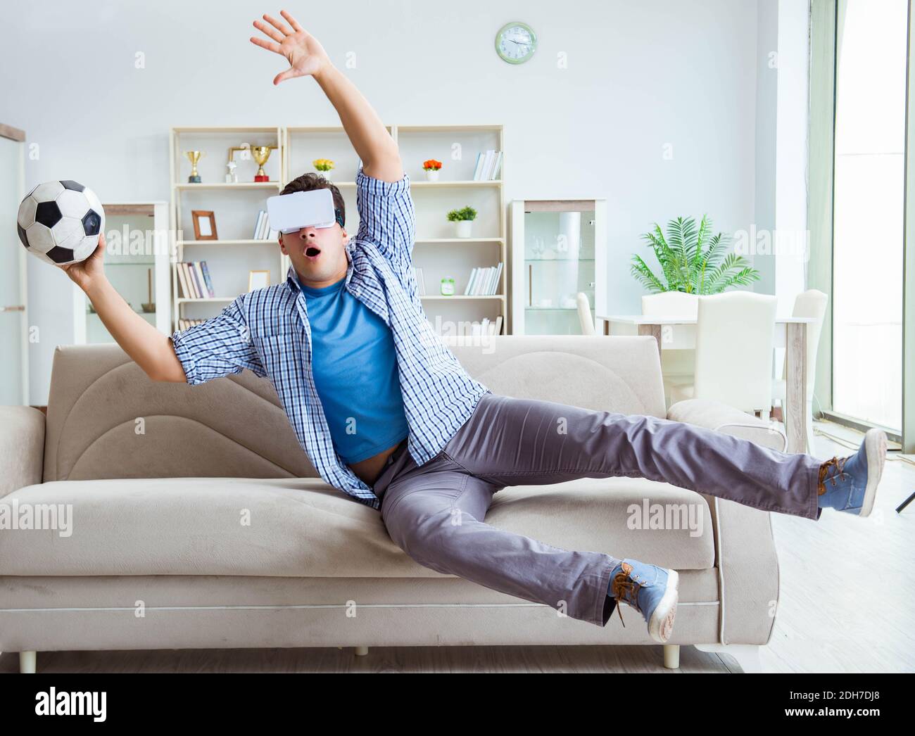 Man wearing virtual reality VR glasses watching soccer football Stock ...