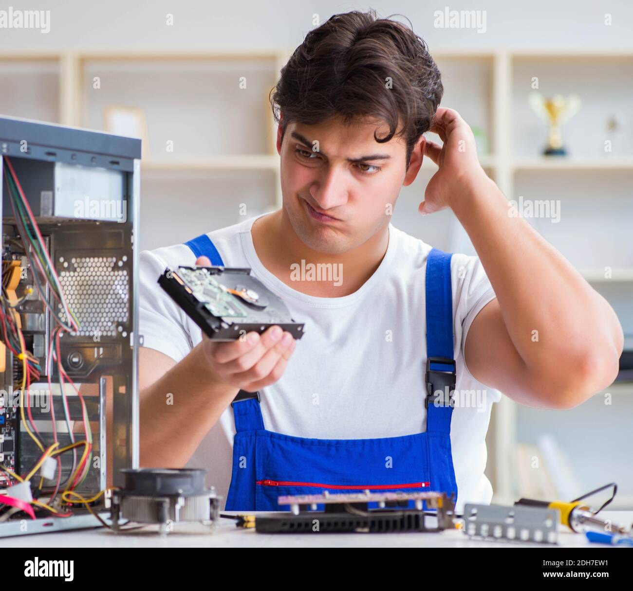 Computer repairman repairing desktop computer Stock Photo - Alamy