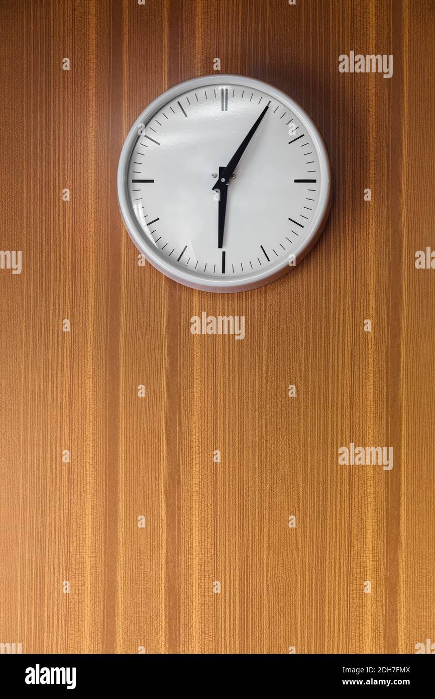 Wood wall with a clock Stock Photo - Alamy