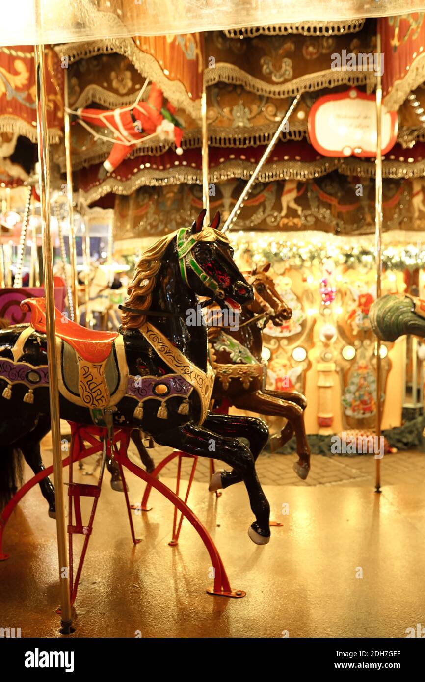 Festive carousel in a holiday park. Merry-go-round with horses Stock ...