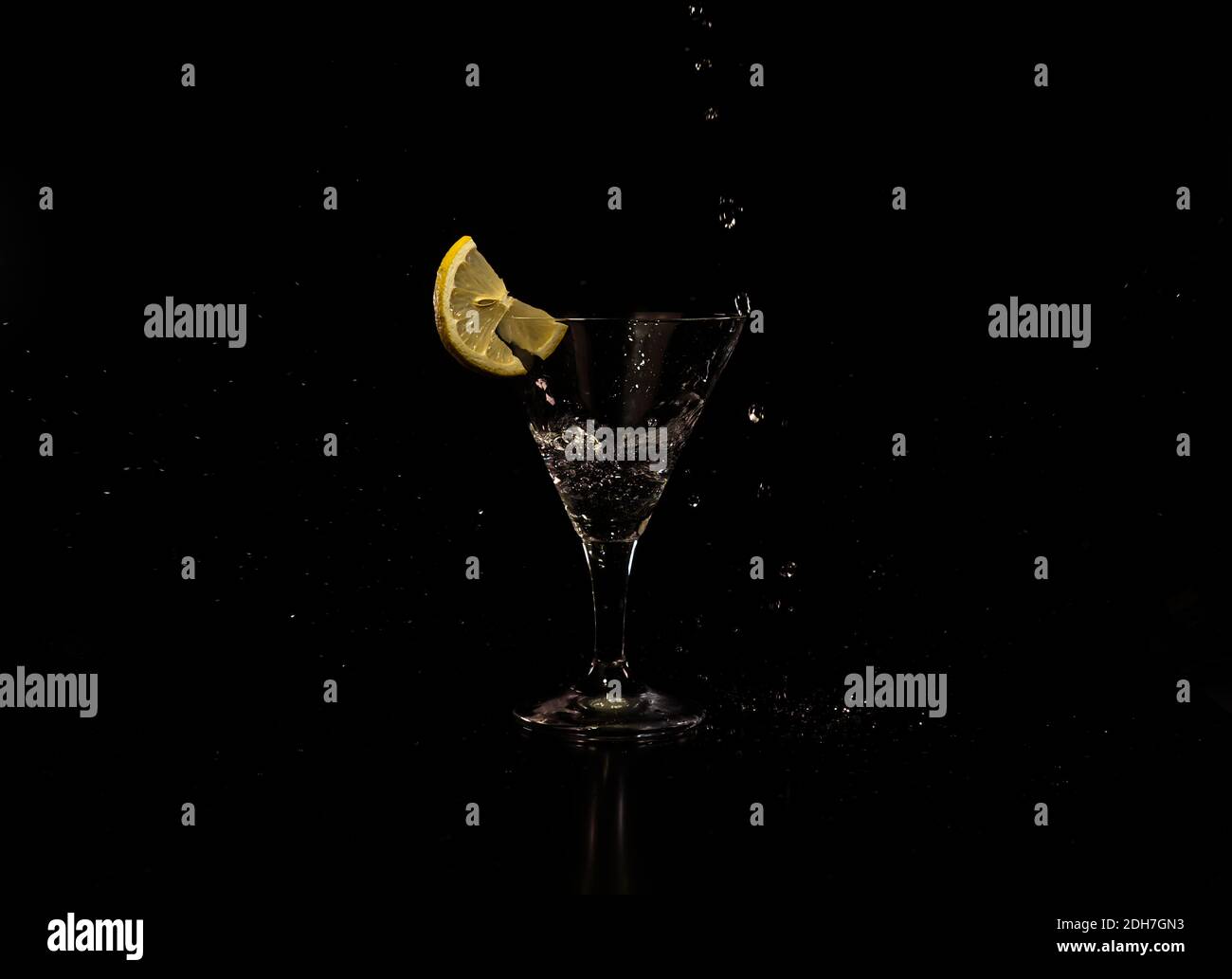 Fill up a martini glass cocktail with citrus fruit Stock Photo - Alamy