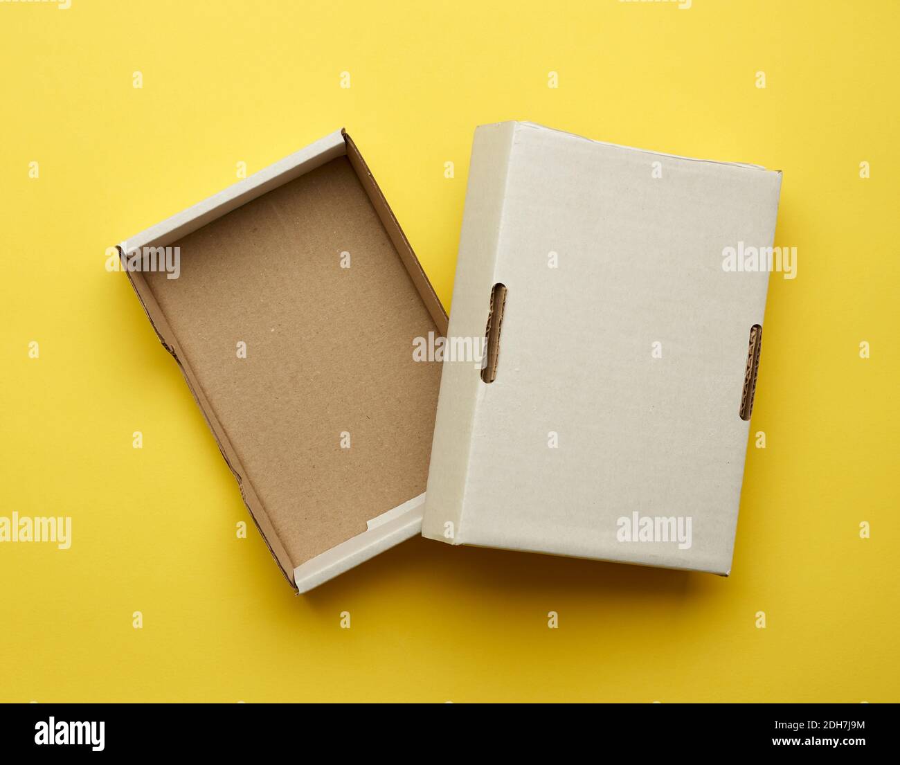 Open empty rectangular box on yellow background Stock Photo - Alamy