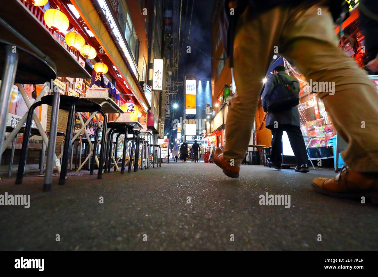 Few people walk in restaurants and bars district in Tokyo's Shimbashi ...