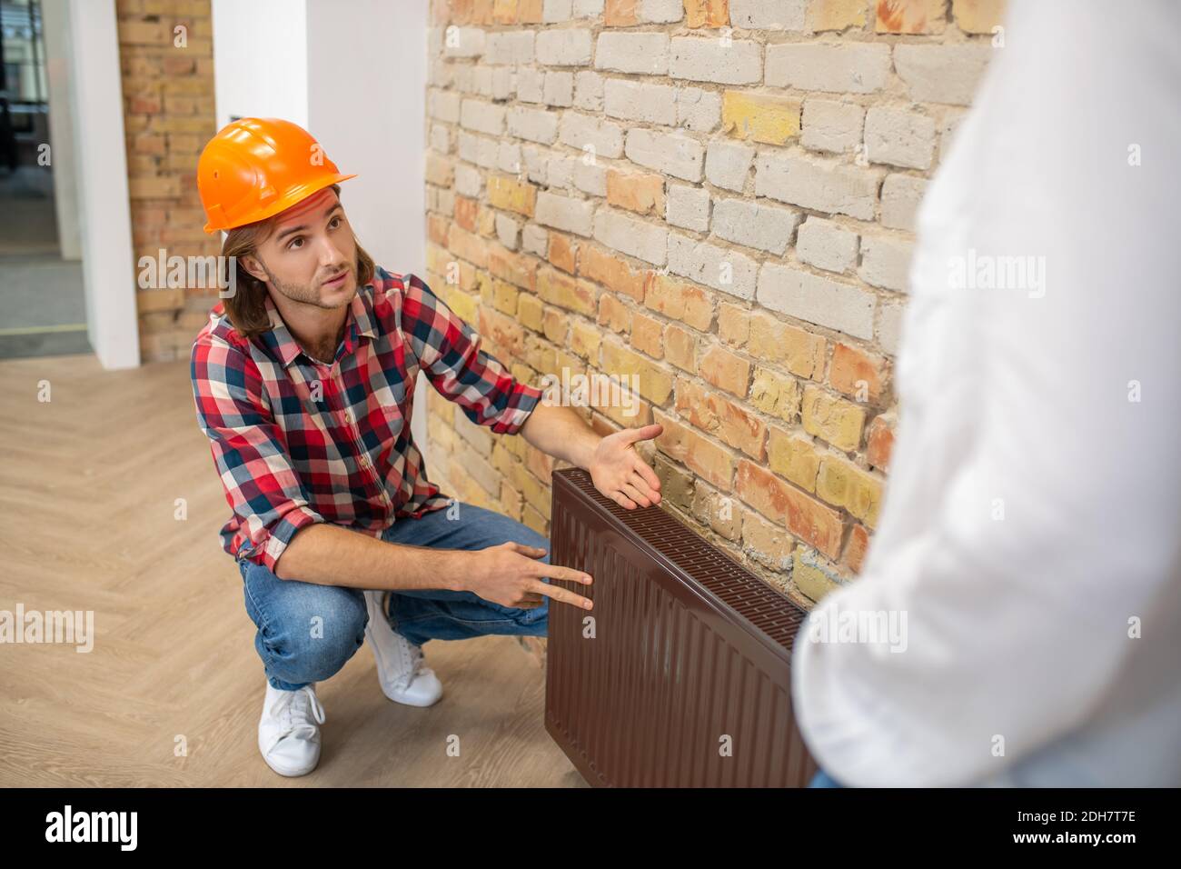 Man explaining something to a woman hi-res stock photography and images ...