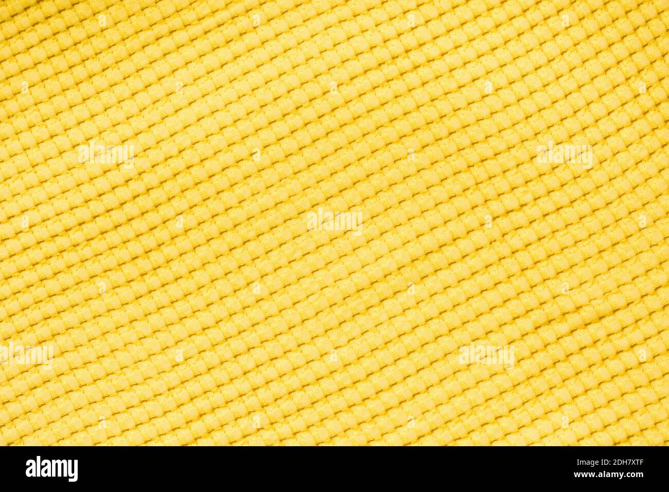 Yellow soft checkered textile. Top view. Abstract diagonal pattern ...