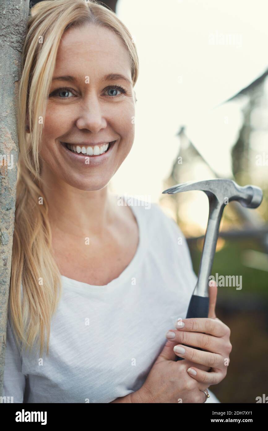 Woman Holding Hammer High Resolution Stock Photography and Images - Alamy