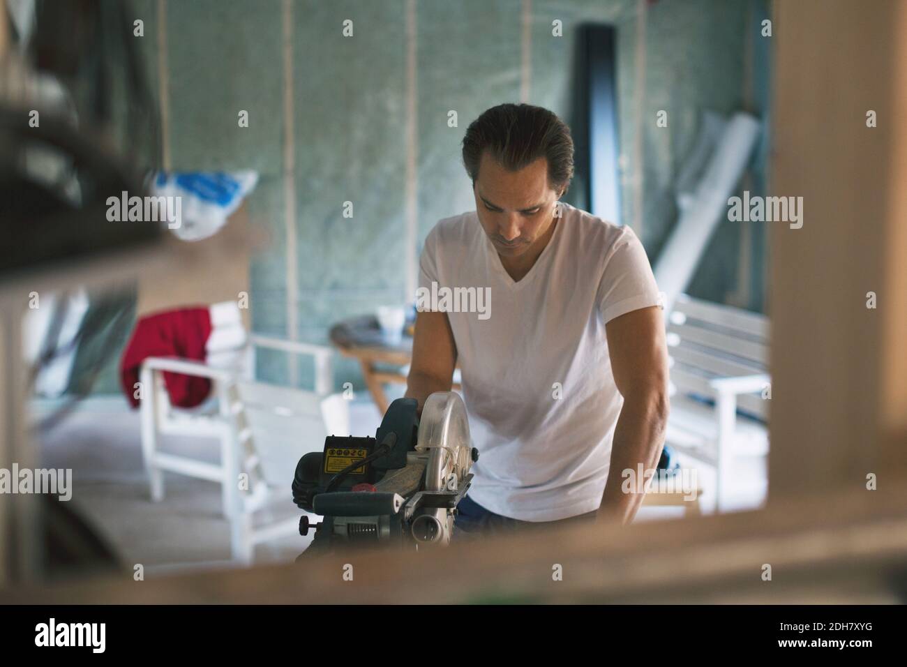 Man using circular saw in during house renovation Stock Photo - Alamy