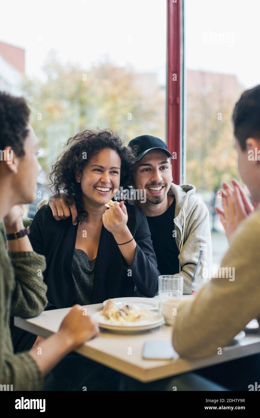Happy university students in cafe Stock Photo - Alamy
