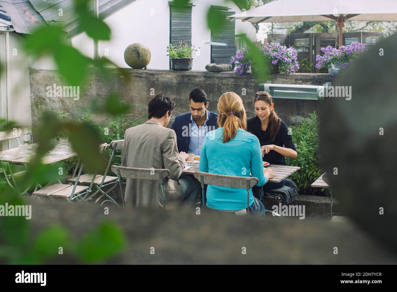 Couples having lunch at outdoor cafe Stock Photo - Alamy