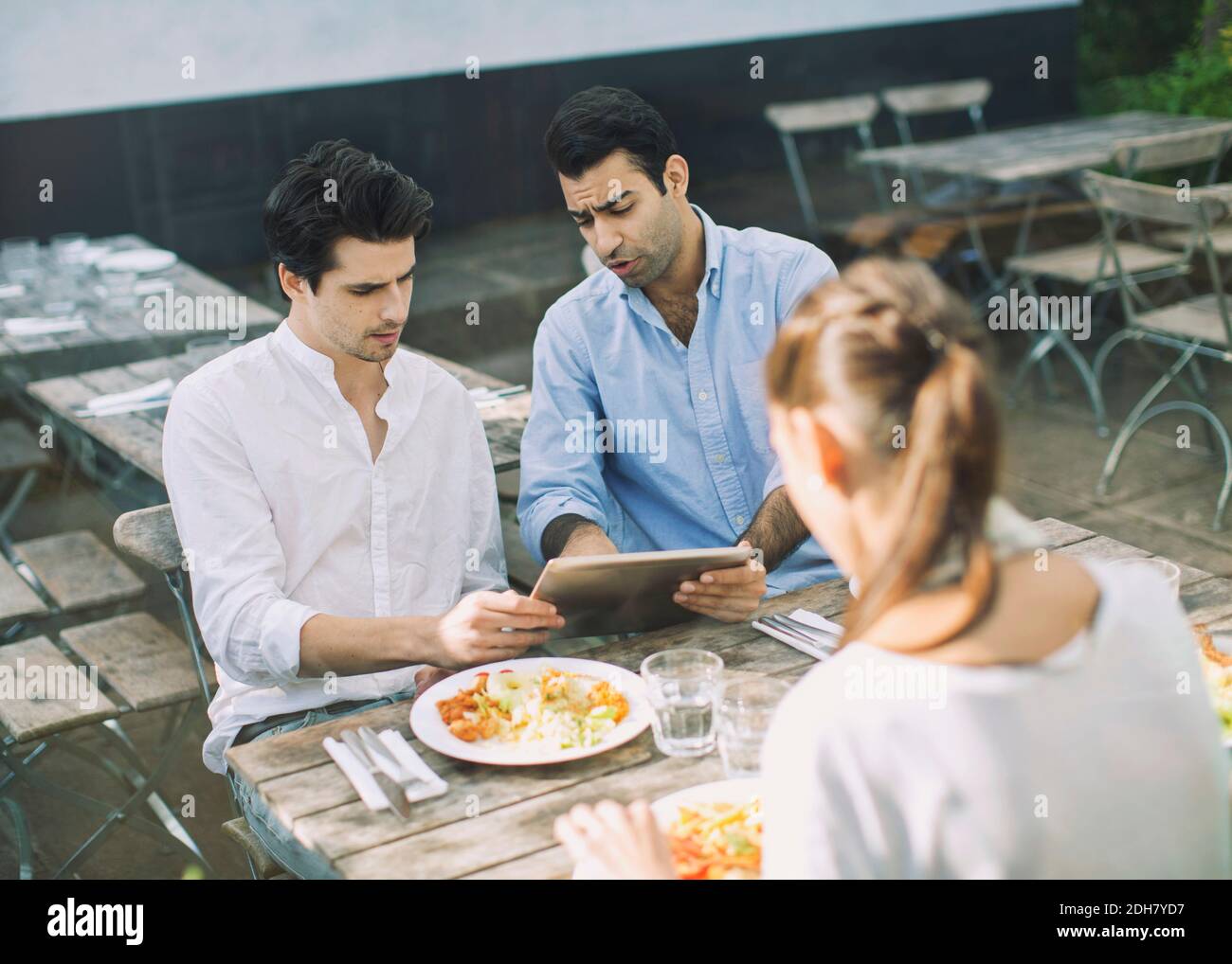 Using tablet outdoor rear view hi-res stock photography and images - Alamy