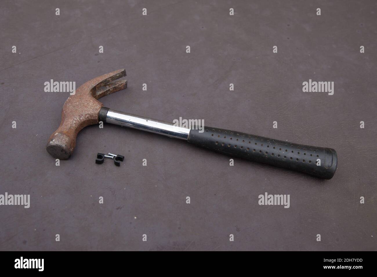 Steel claw hammer and cable clips Stock Photo - Alamy