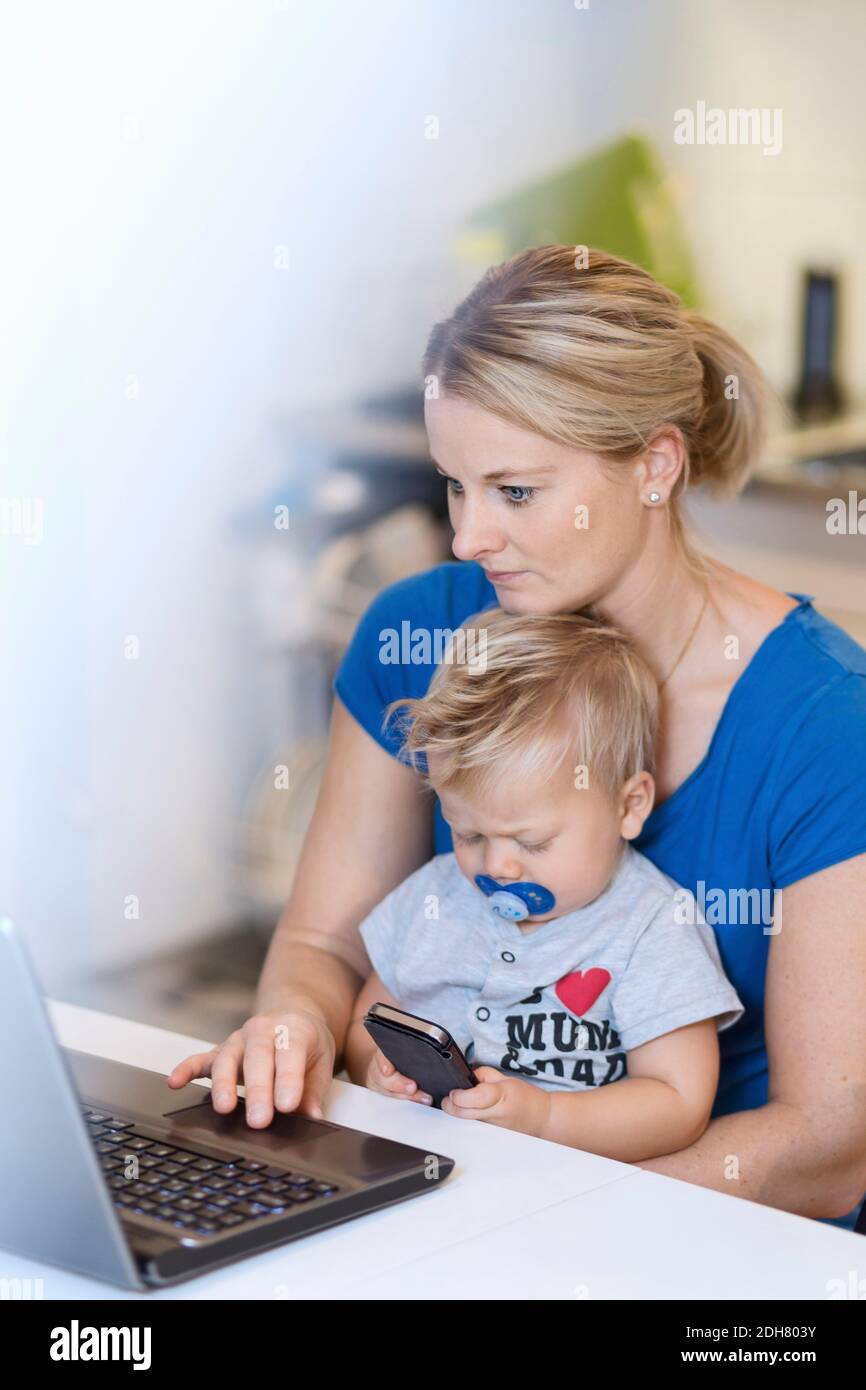 Baby working on laptop hi-res stock photography and images - Alamy