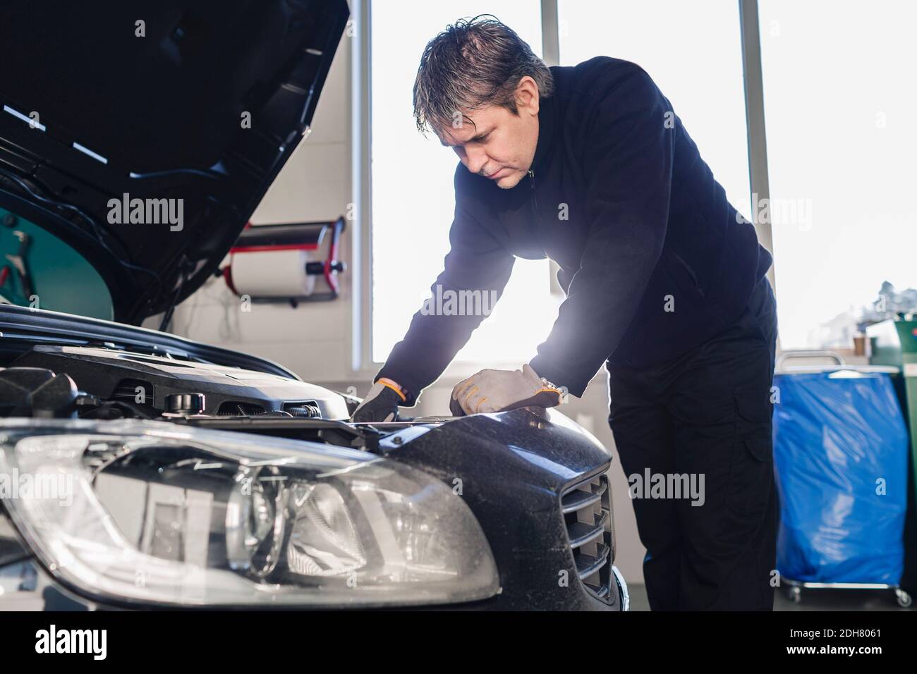 Mechanic in auto service repairing hi-res stock photography and images ...