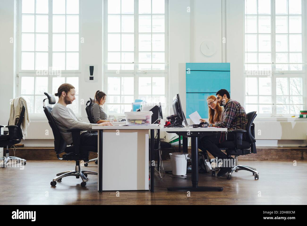 Men working at their desks hi-res stock photography and images - Alamy