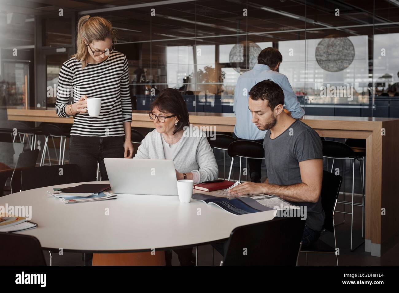 Business people working at office cafe Stock Photo - Alamy