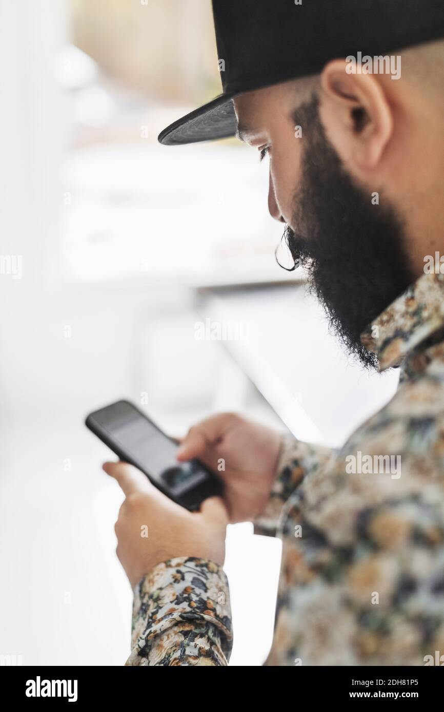 Side view man using mobile hi-res stock photography and images - Alamy
