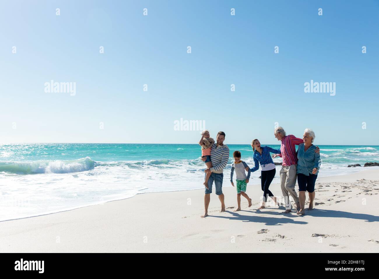 Family spending time at the beach Stock Photo - Alamy