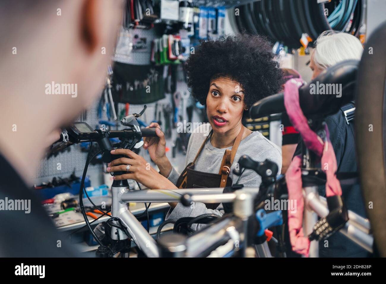 Female mechanic repairing machines hi-res stock photography and images ...