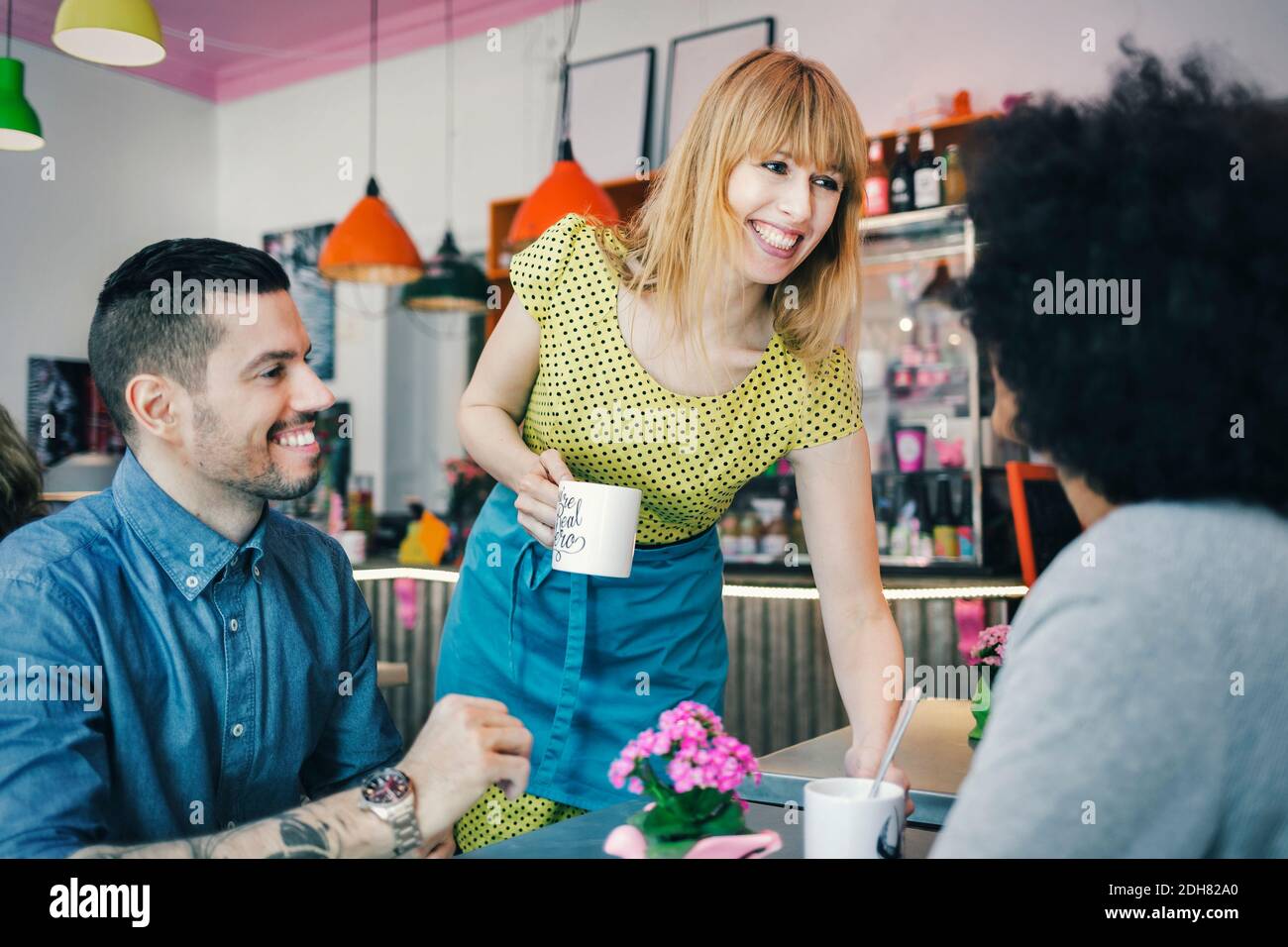 Woman serving customers hi-res stock photography and images - Alamy
