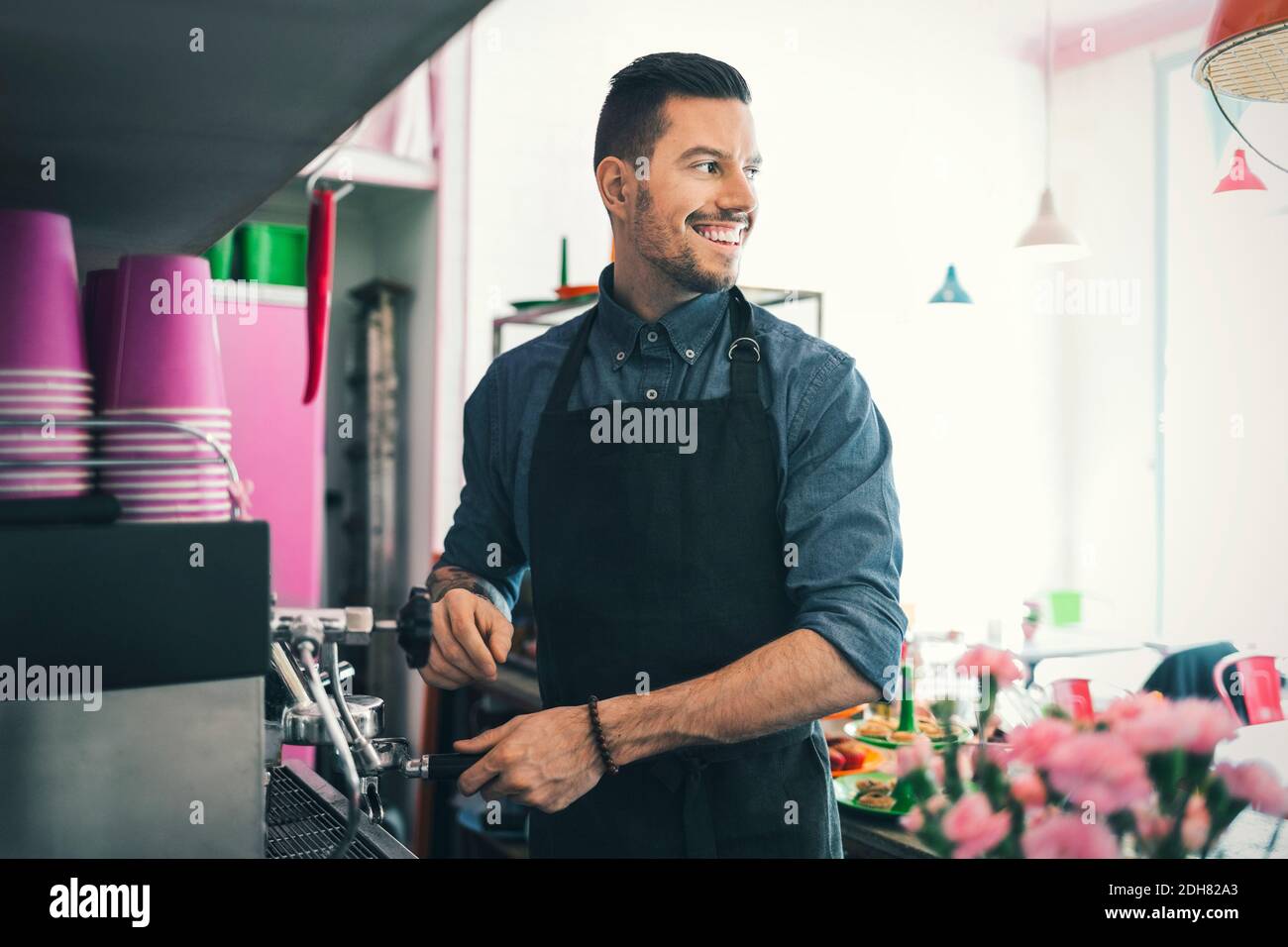 Barista preparing coffee in cafe Stock Photo - Alamy