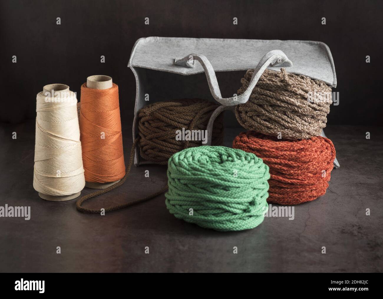 A closeup shot of woolen sewing threads in elegant colors in front of a ...