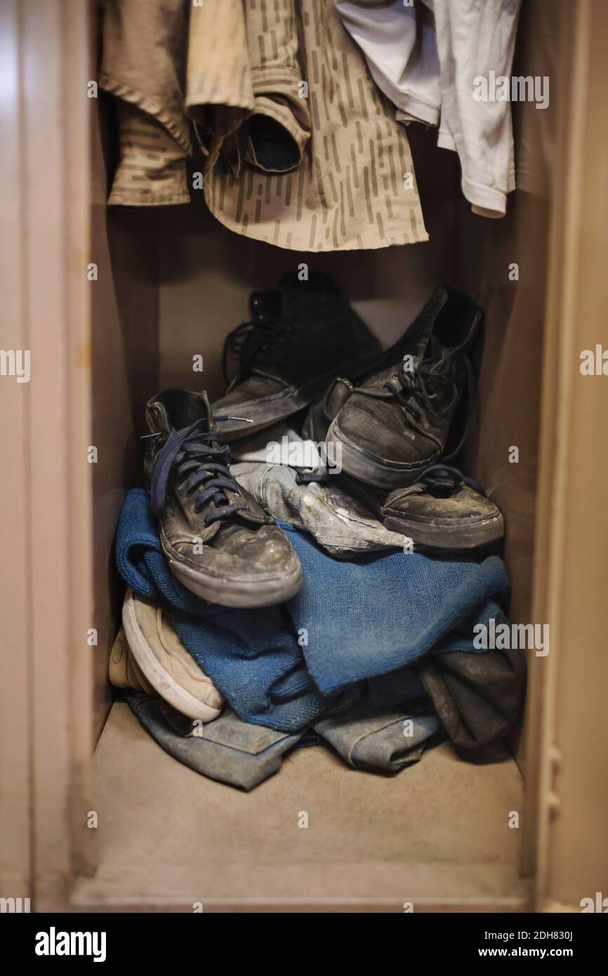Carpenter's clothing in cabinet at workshop Stock Photo - Alamy