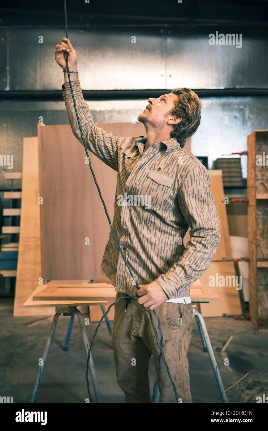 Worker holding control panel factory hi-res stock photography and ...
