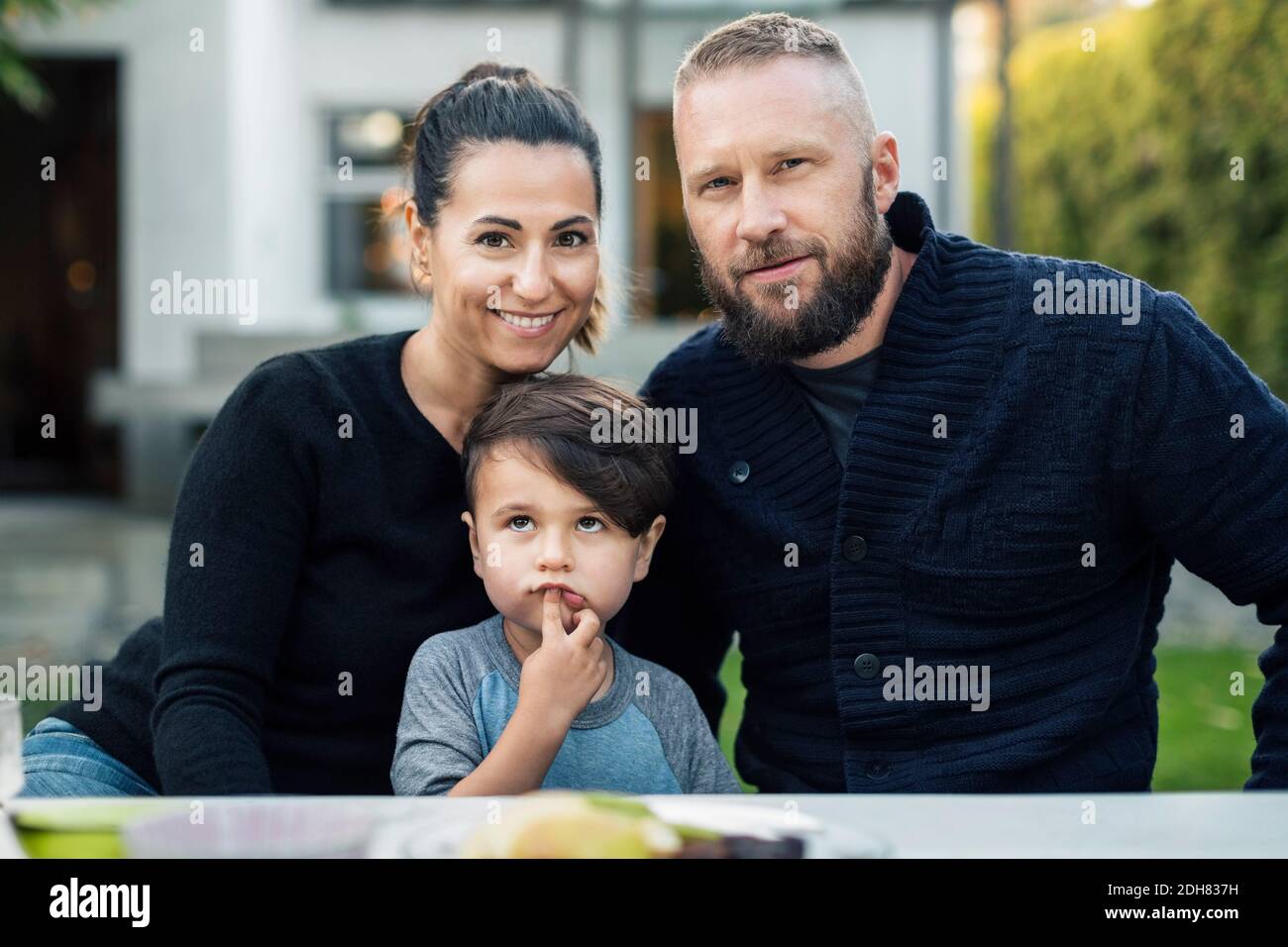 Happy family looking camera together hi-res stock photography and ...