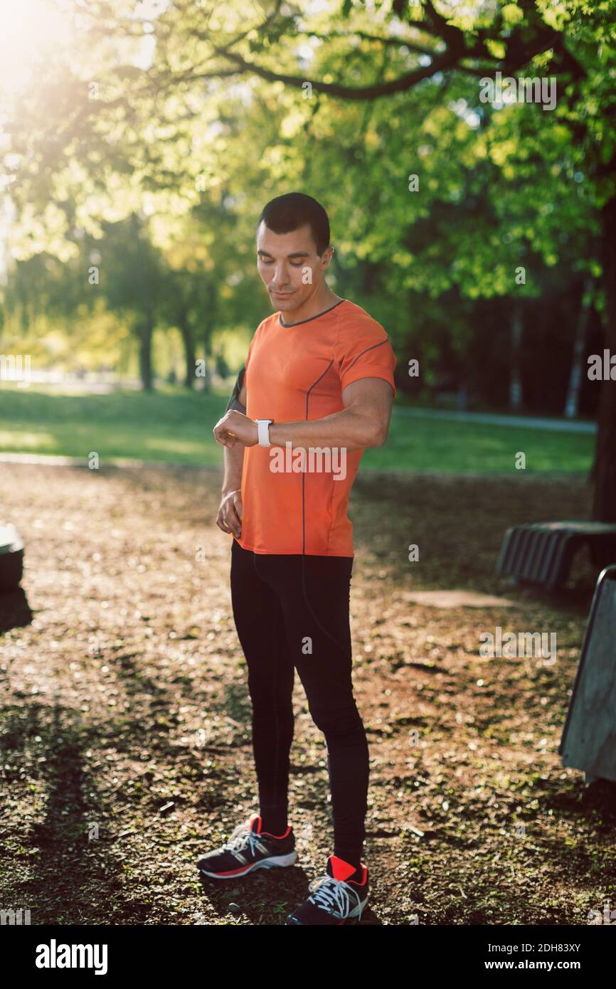 Man running watch park hi-res stock photography and images - Alamy