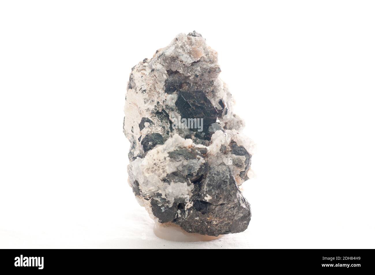 andradite dark crystal mineral sample in quartz and granite Stock Photo ...