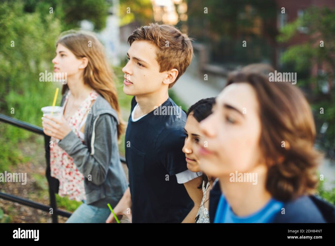 Teenagers moving up steps outdoors Stock Photo - Alamy