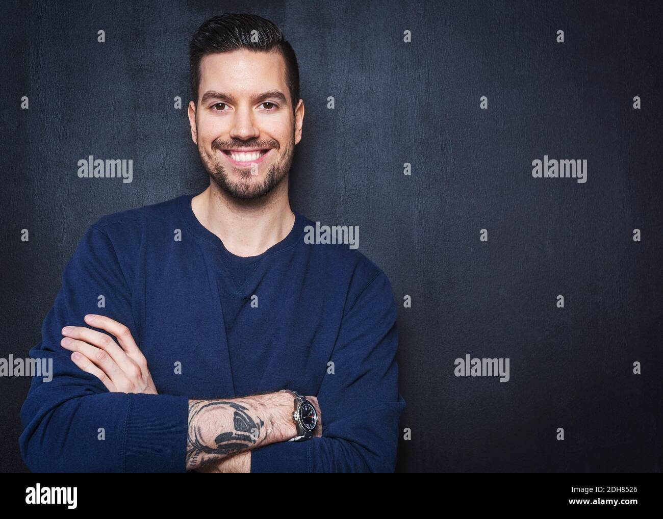 Businessman smiling arms crossed against hi-res stock photography and ...