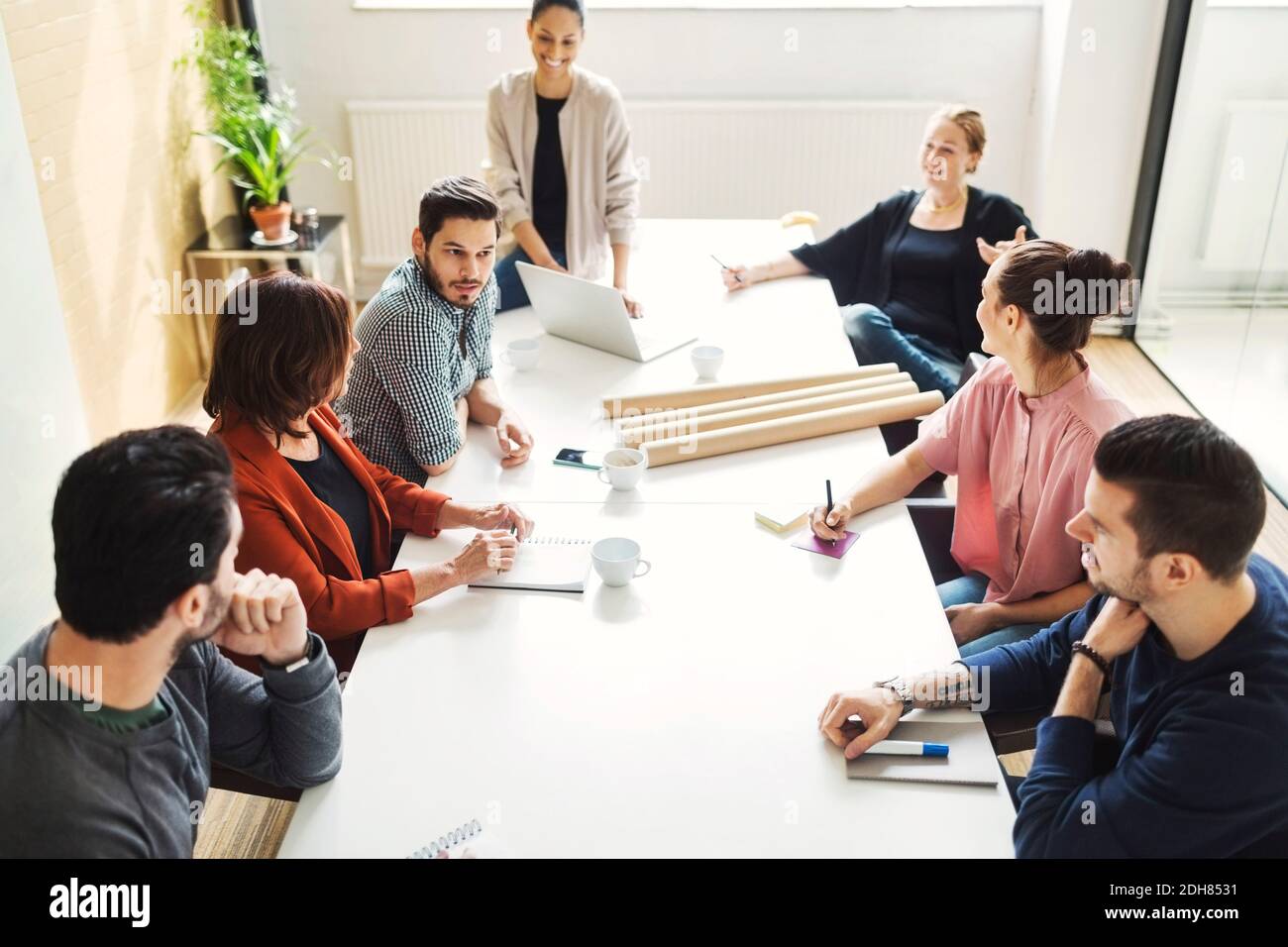 High angle view of business people having discussion at table in ...