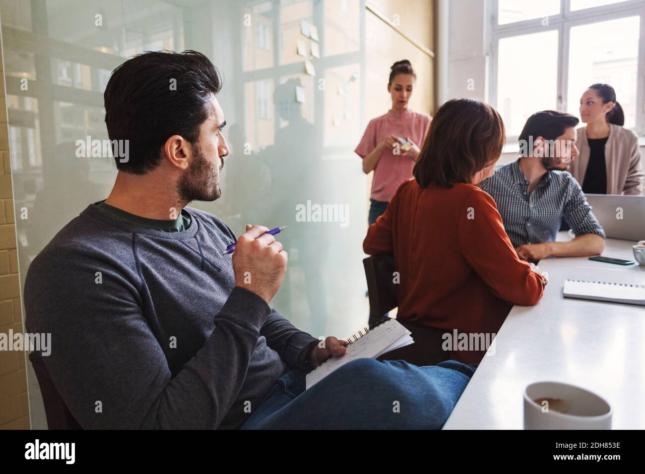 Multi-ethnic business people having discussion in meeting room Stock ...