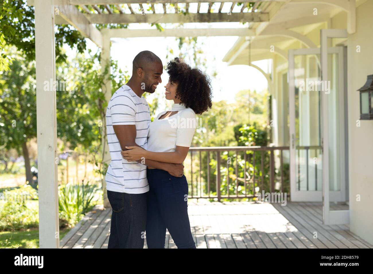 Happy couple holding each other Stock Photo - Alamy