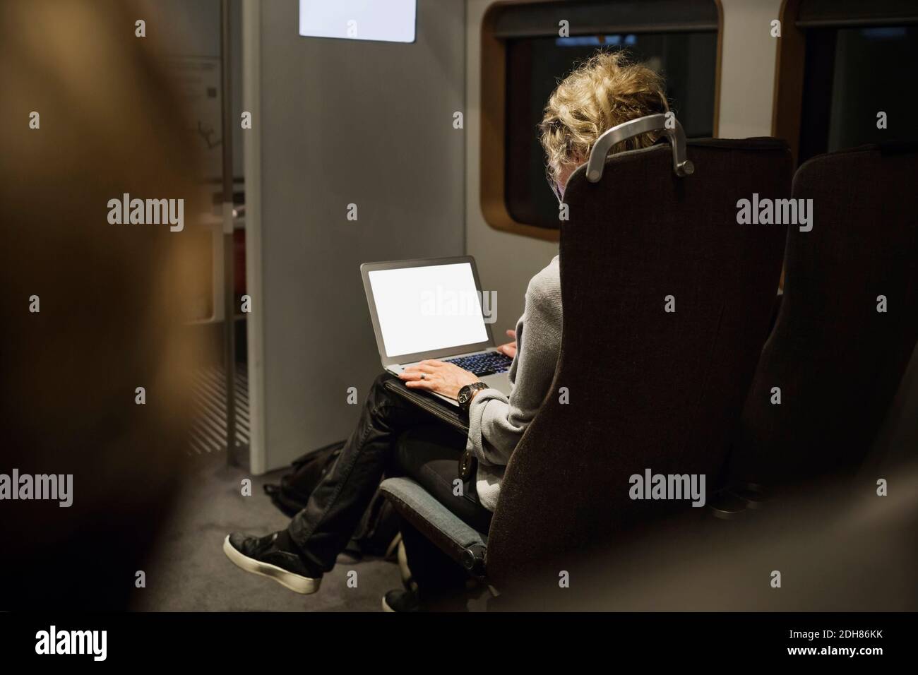 Using computer on train hi-res stock photography and images - Alamy