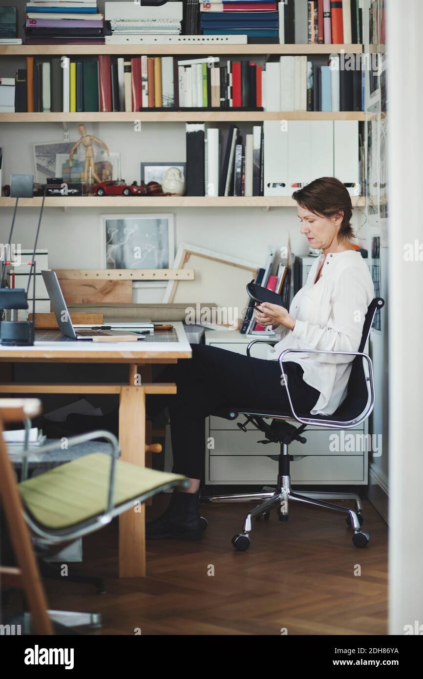 Side view of architect working on product at home office Stock Photo ...