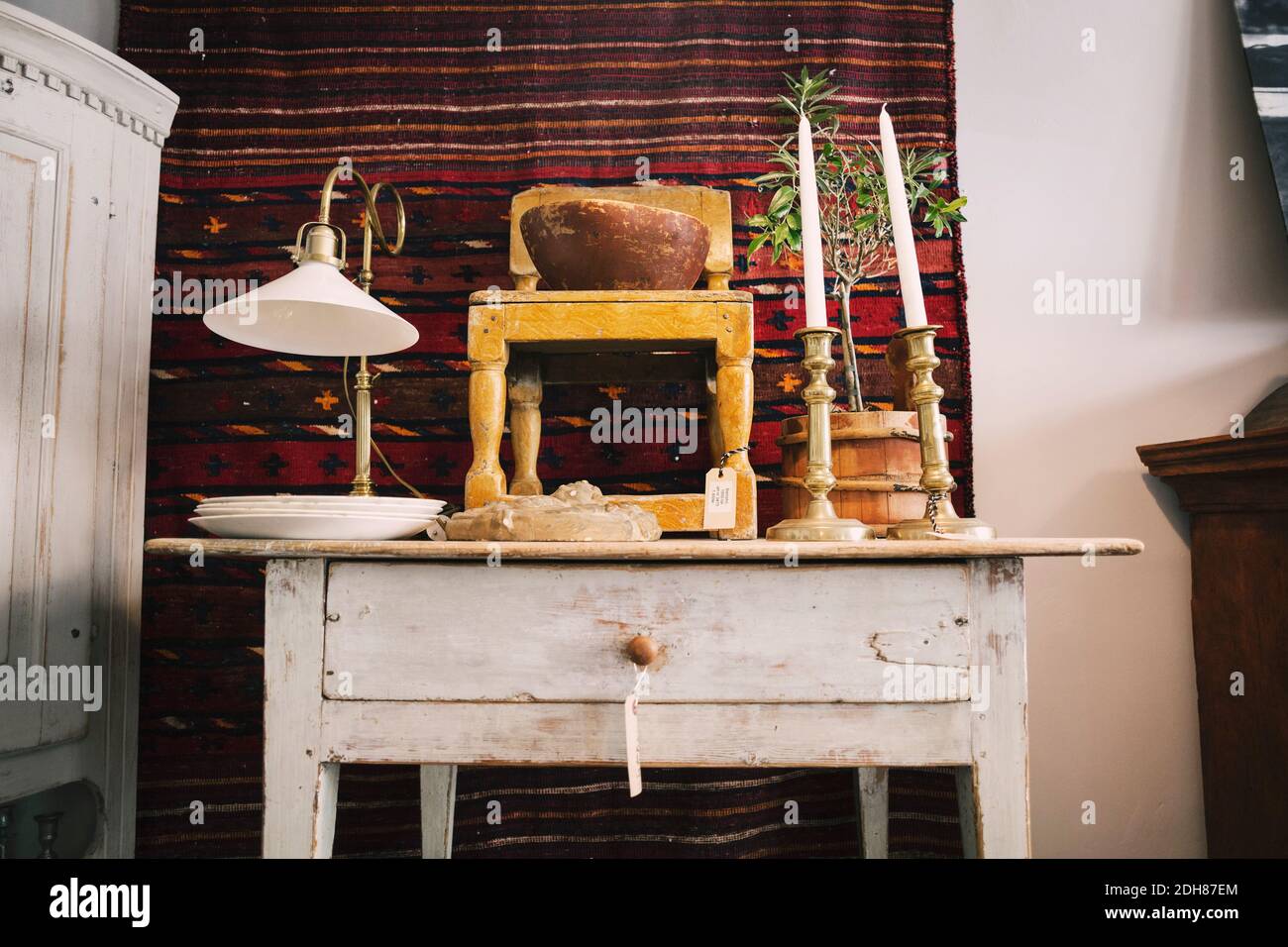 Antique objects on table in store Stock Photo - Alamy