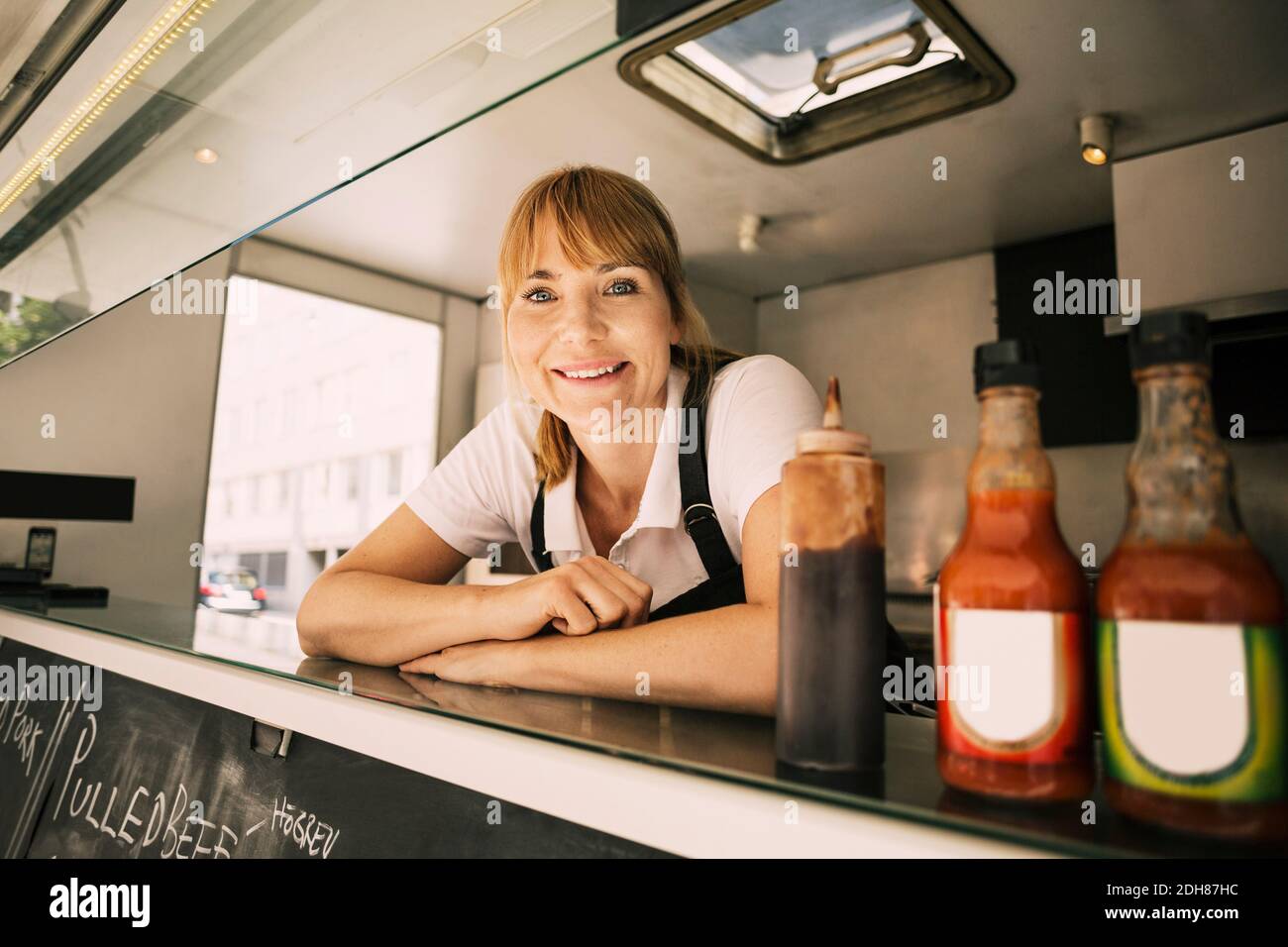 Leaning on counter hi-res stock photography and images - Alamy