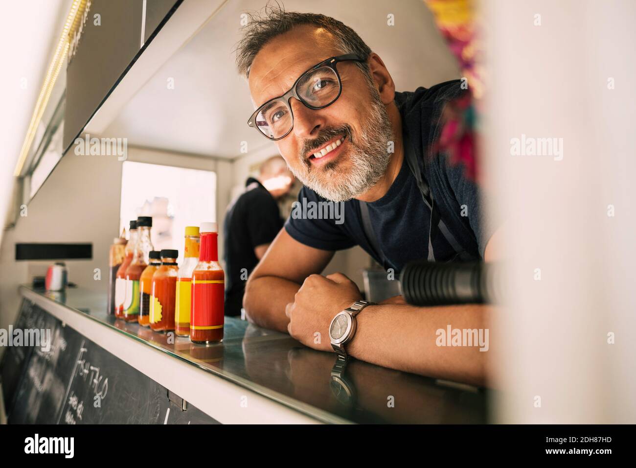 Leaning on counter hi-res stock photography and images - Alamy