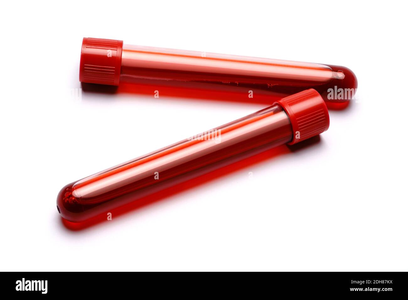Test tube with red plug isolated on white background Stock Photo - Alamy
