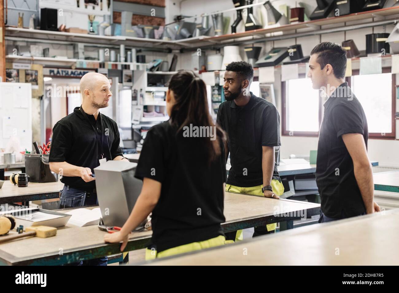 Group students table teacher hi-res stock photography and images - Alamy