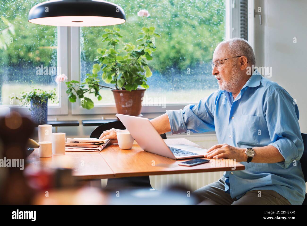 Man reaching for book hi-res stock photography and images - Alamy