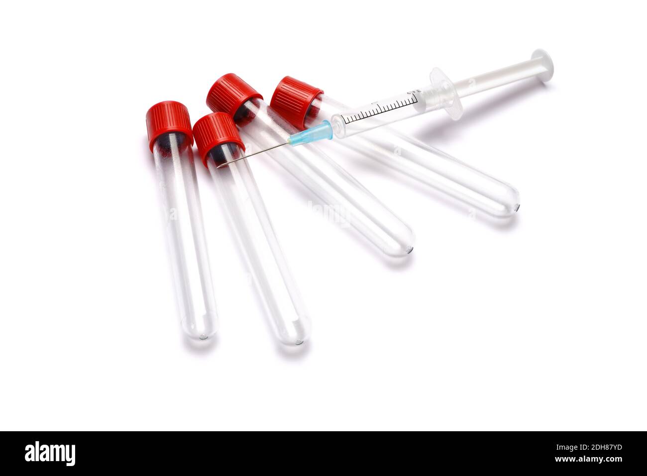 Medical syringe and plastic test tube isolated on white background ...